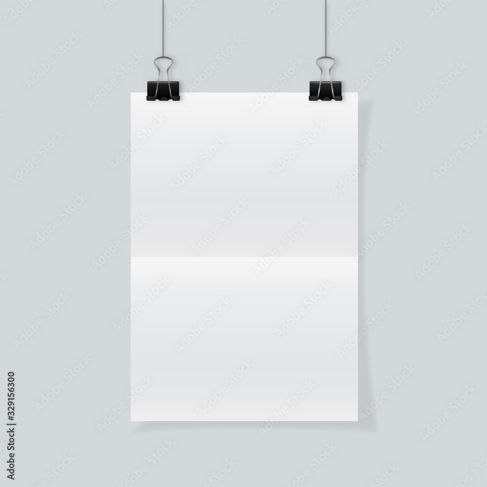 Paper poster. White blank sheet folded in two hanging on wall. Poster ...