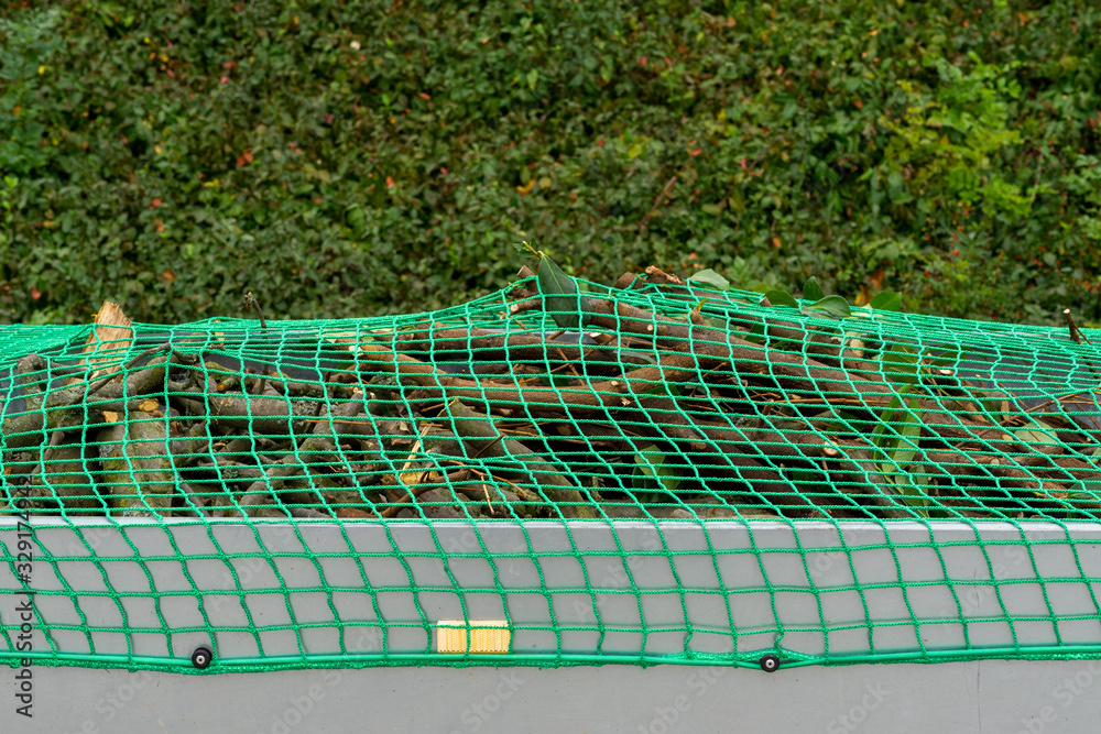 Car trailer with net for load securing Stock Photo | Adobe Stock