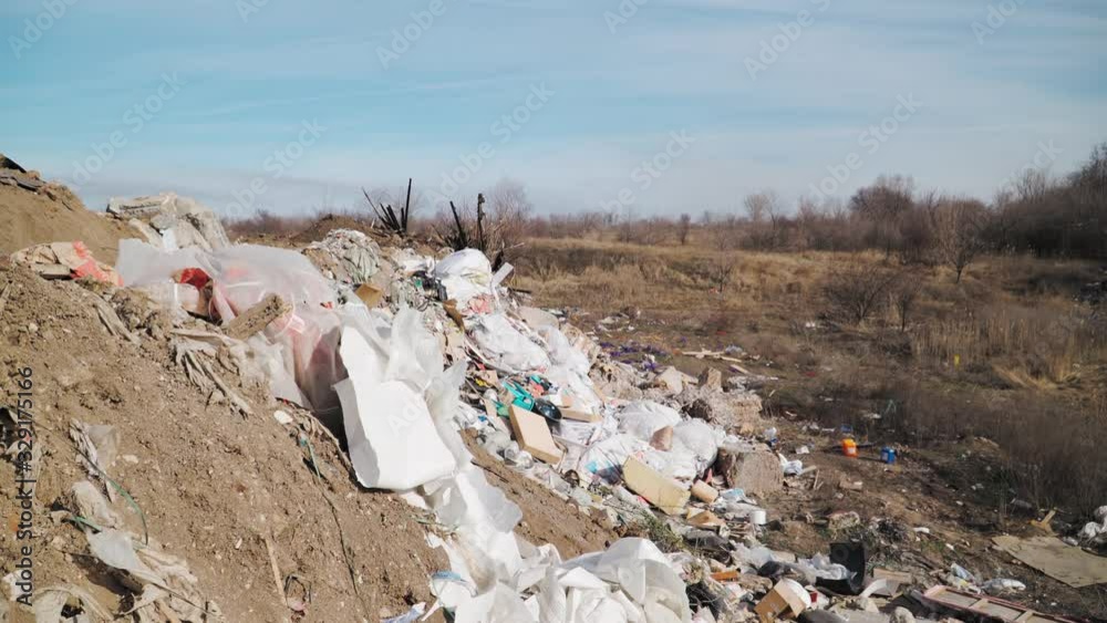 Big piles of garbage. Empty bottles, plastic in the waste dump ...