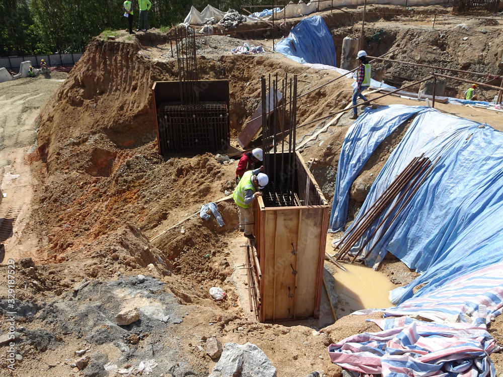 Pile cap and column stump under construction at the construction site ...