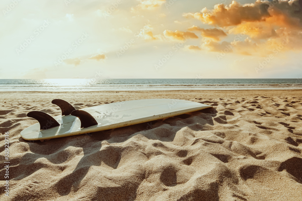 Surfboard on beach background at sunset. Travel adventure and water ...