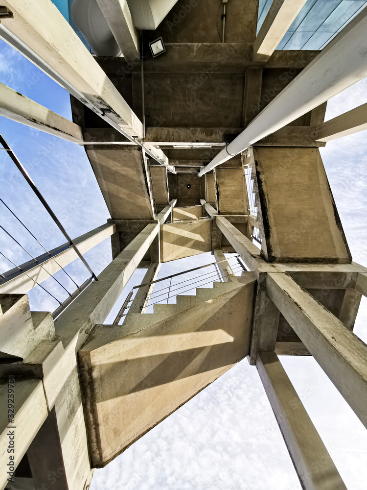 Bottom shot to fire stair tower building . Perspective with cement and ...