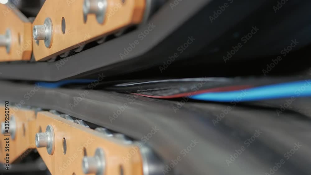 The multi-core cable in the shell moves along the conveyor line. Stock ...
