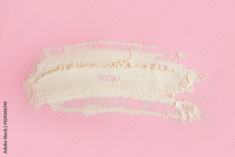 Frame of food ingredients for baking on a gently pink pastel background ...