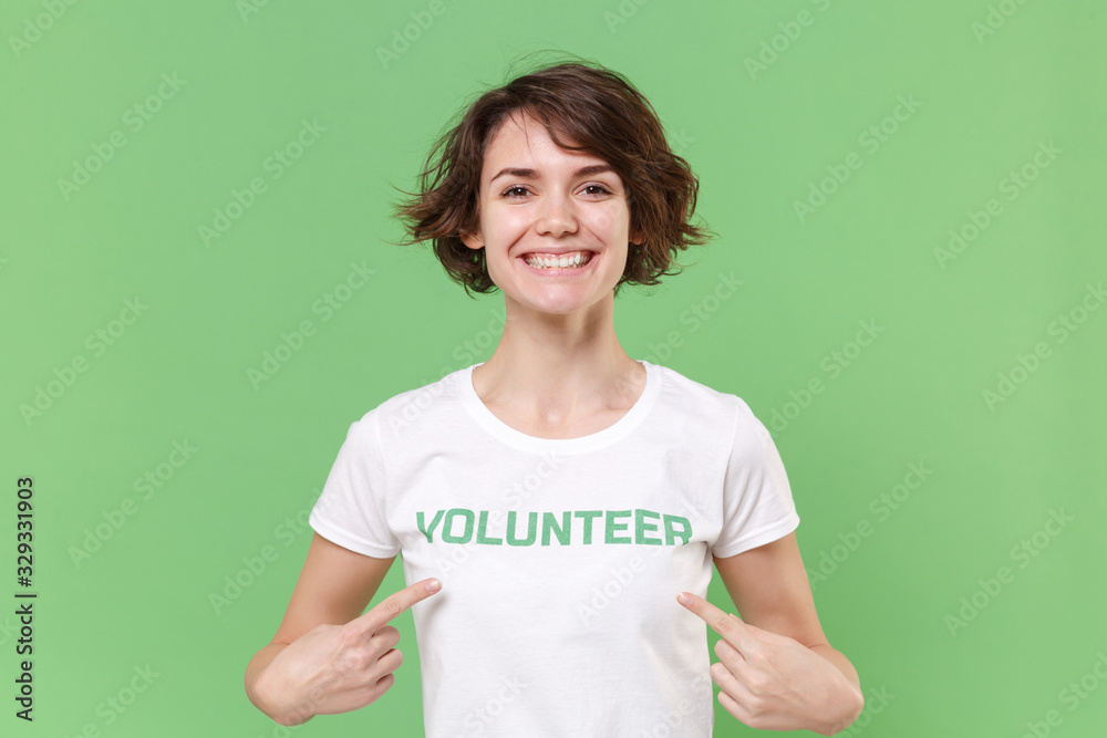 Smiling young brunette woman in white volunteer t-shirt isolated on ...