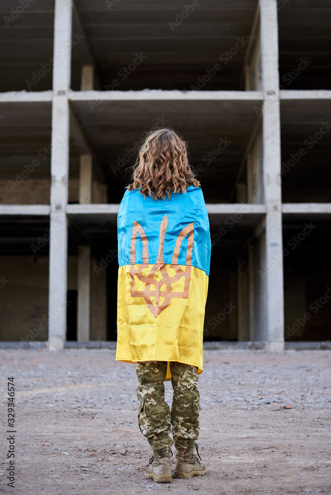 Young curly military woman, wearing ukrainian army uniform, with her ...