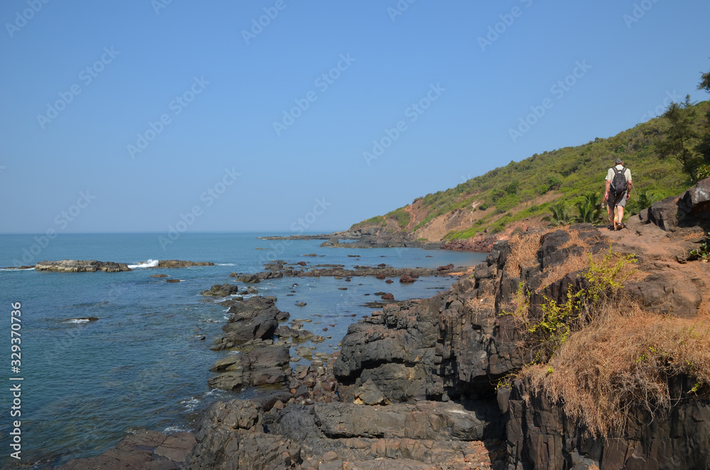 Nature in North Goa. India. Red earth, volcanic rocks and boulders ...