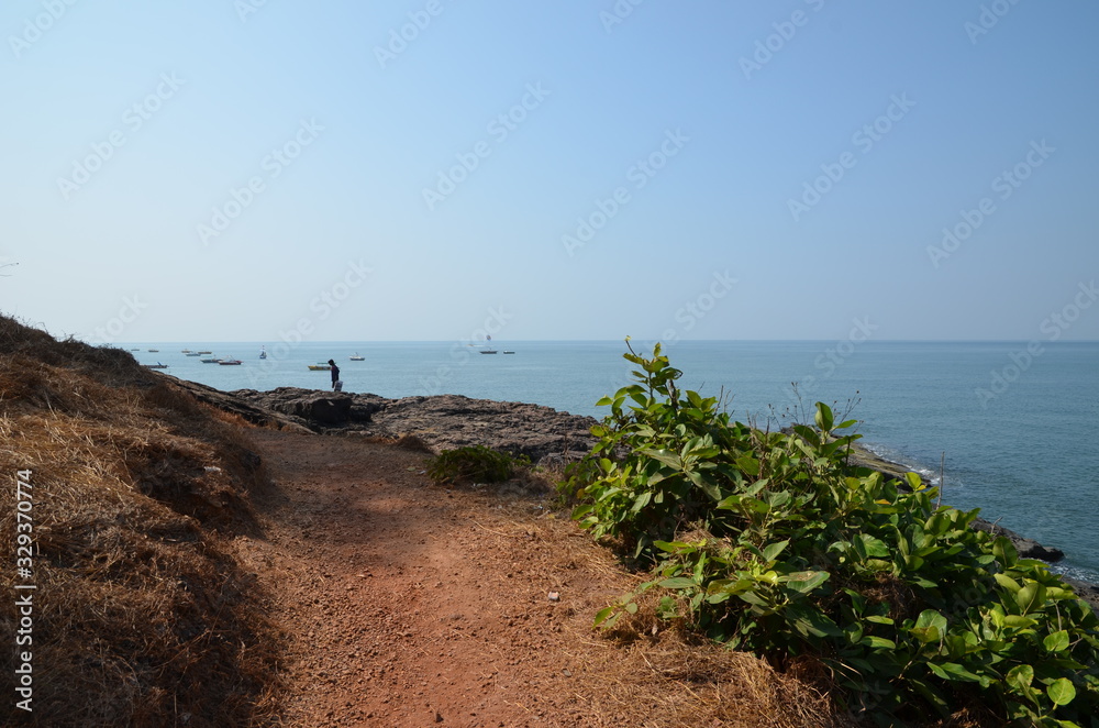 Nature in North Goa. India. Red earth, volcanic rocks and boulders ...