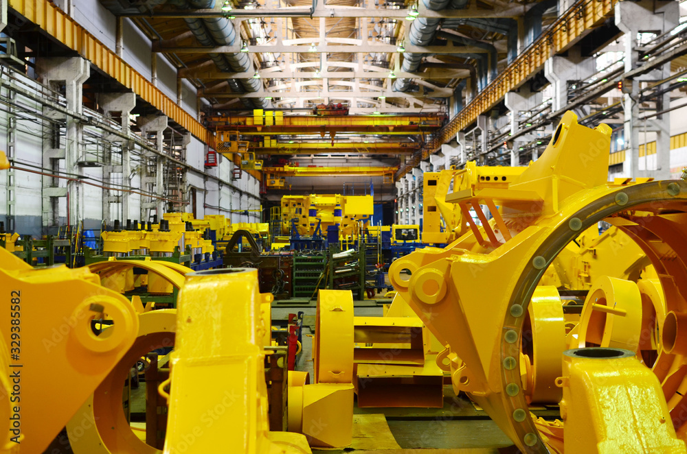 Production process of heavy mining trucks at the factory. Dump truck on ...