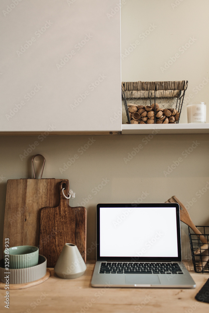 Kitchen workspace with blank copy space mock up laptop screen. Modern ...