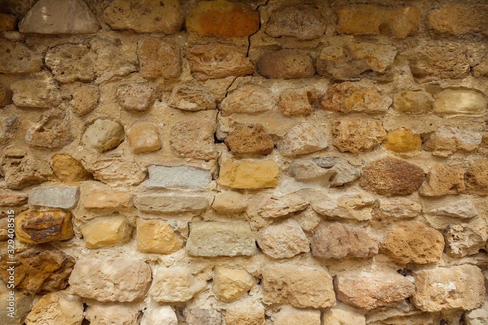 Old limestone brick wall. Yellow stone wall texture. Stock Photo ...
