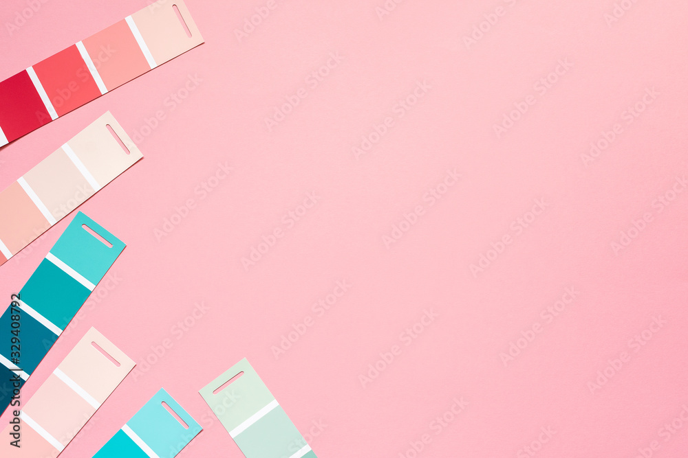 Selection of palette for painting, sample color catalog on a pink ...