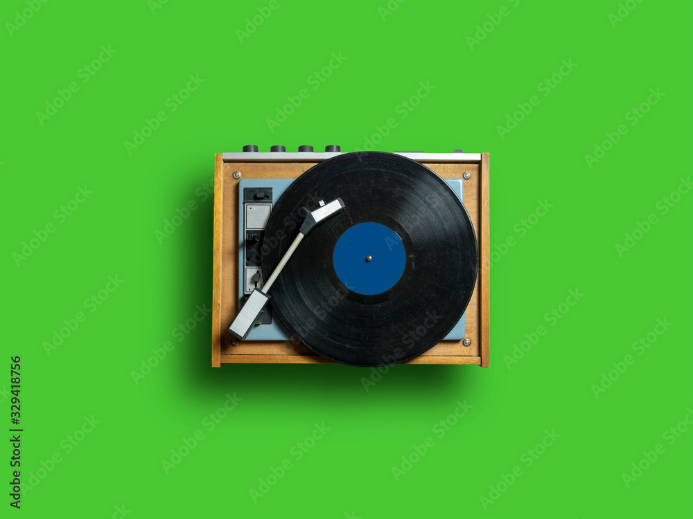 vintage vinyl record player with plate on colorful background in trendy ...