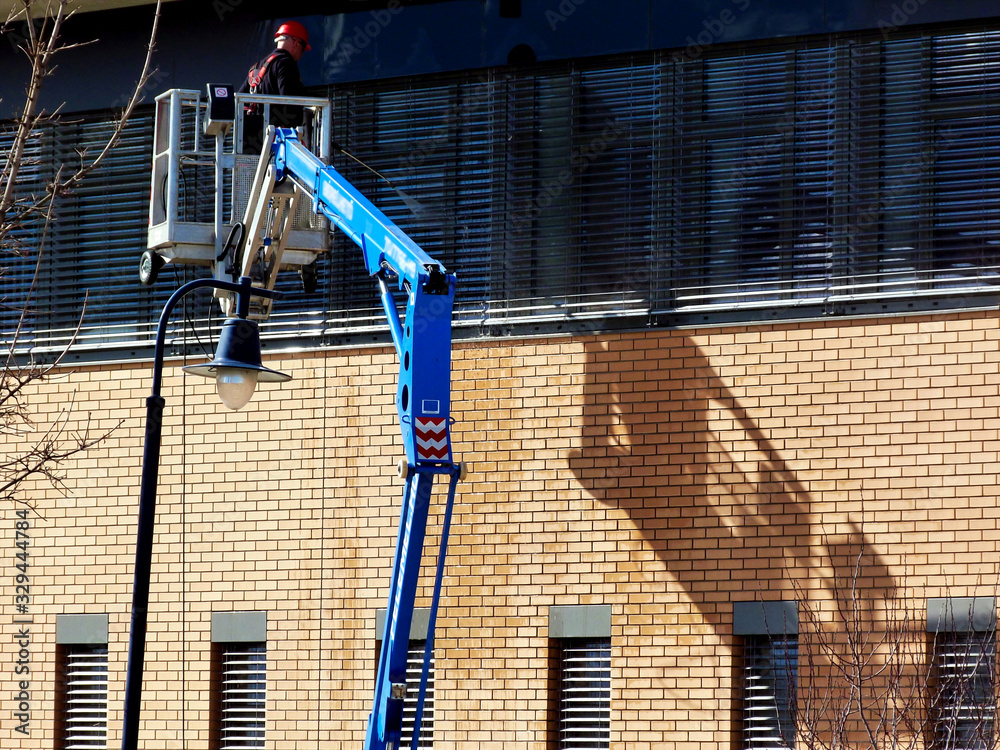 high level window cleaning from telescopic cage or cherry picker ...