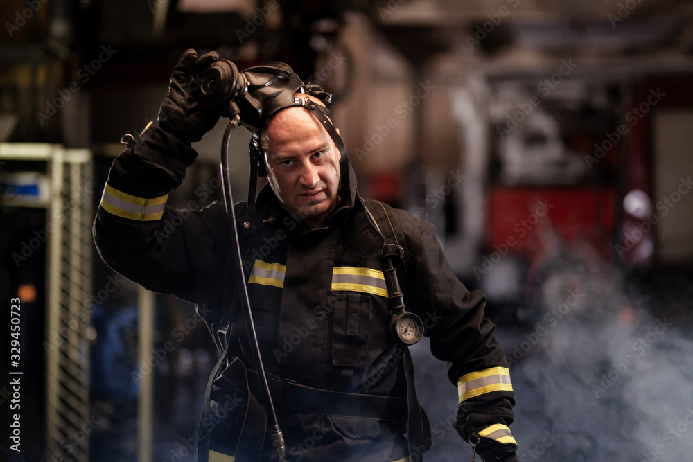 firefighter portrait wearing full equipment and emergency rescue ...