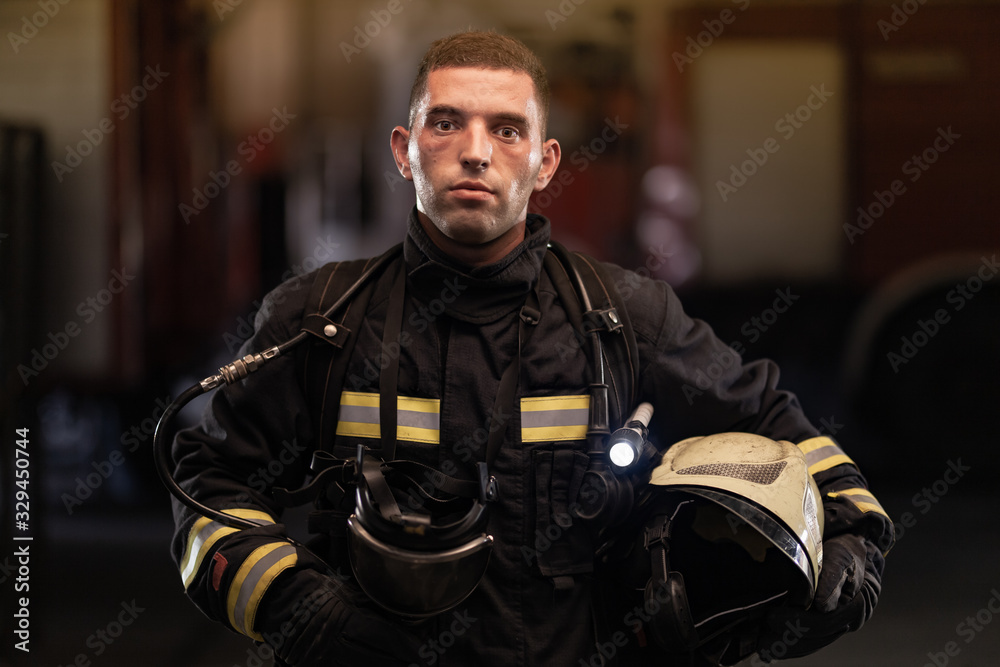 firefighter portrait wearing full equipment and emergency rescue ...