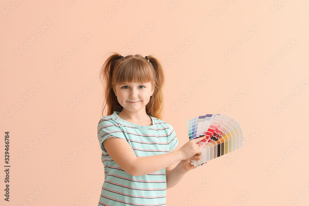 Little girl with color palettes on pink background Stock Photo | Adobe ...