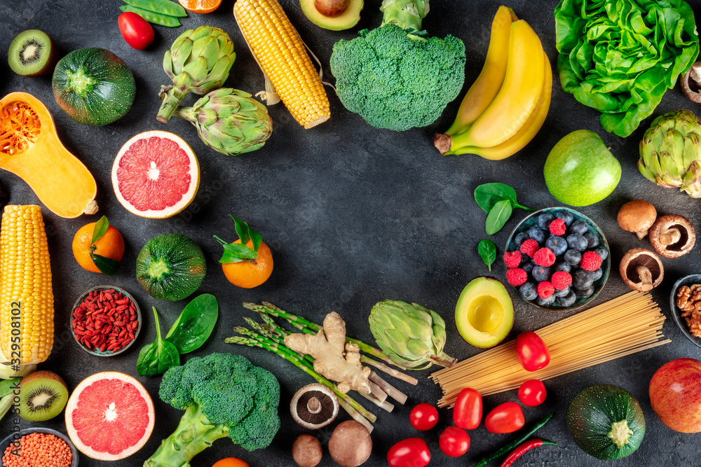 Vegan food, top shot of fruits, vegetables, pasta, legumes, mushrooms ...
