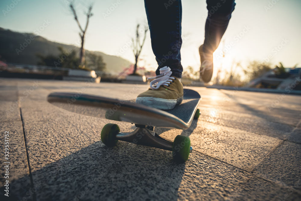 Skateboarder skateboarding at sunrise park Stock-Foto | Adobe Stock