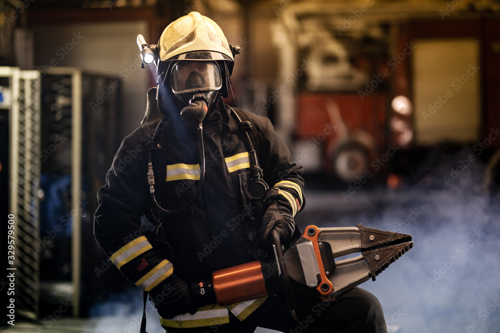 firefighter portrait wearing full equipment, oxygen mask, and power ...