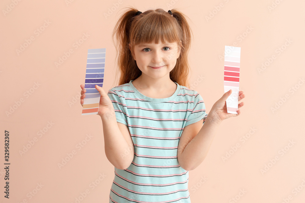 Little girl with color palettes on pink background Stock Photo | Adobe ...