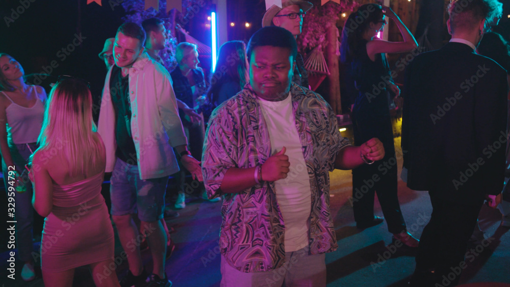 Attractive positive african guy rocking the party off dancing into cool ...