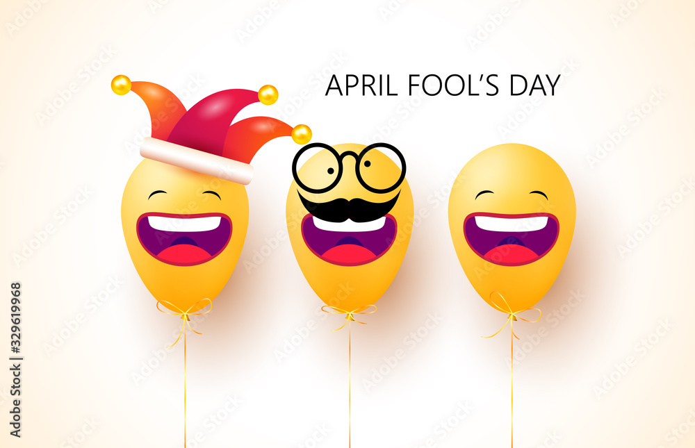 April fool's day. Happy face emoji balloons with jester hat and funny ...