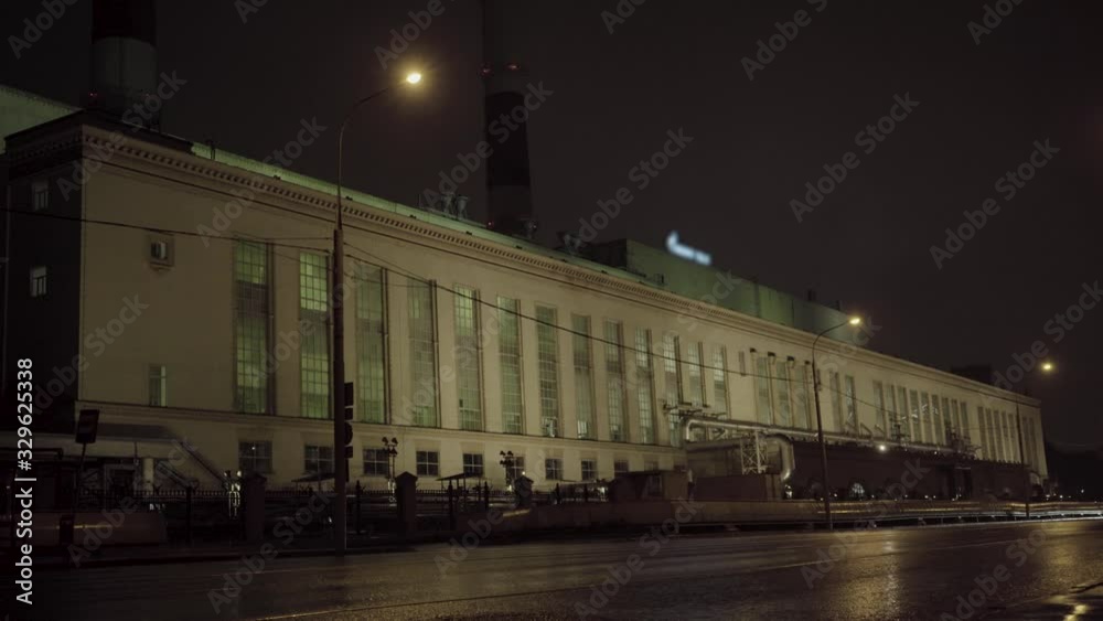 Facade of factory at night. Scene. Appearance of small factory with ...