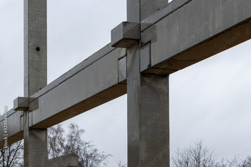 concrete cross beams are connected to concrete columns for a factory ...