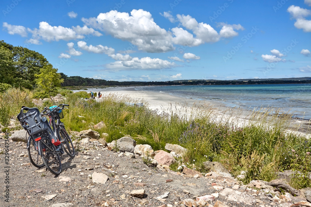 Bicycles parked by the Baltic Sea beach in Snogebaek, Bornholm island ...