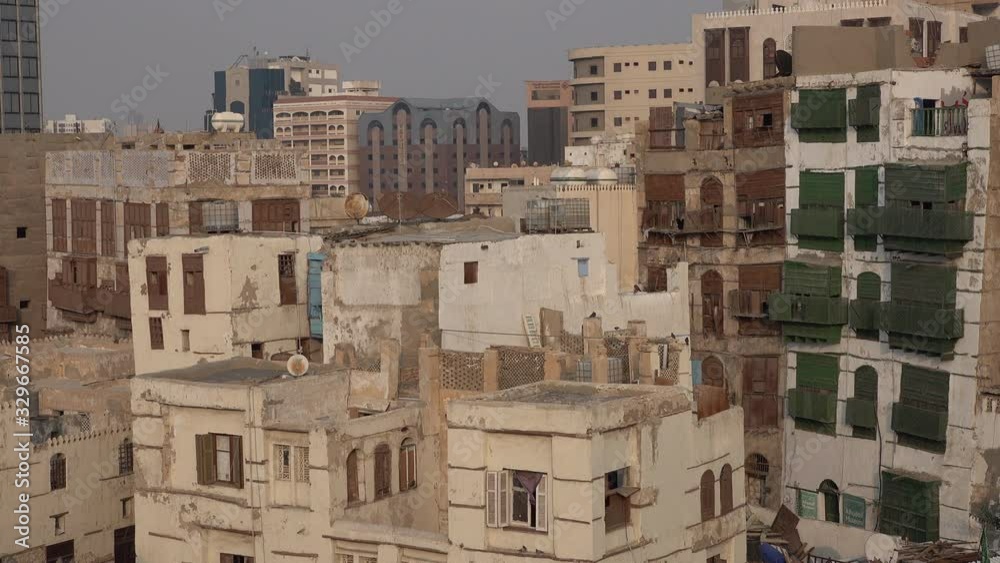 Contrast between historic coral stone buildings and modern offices in ...
