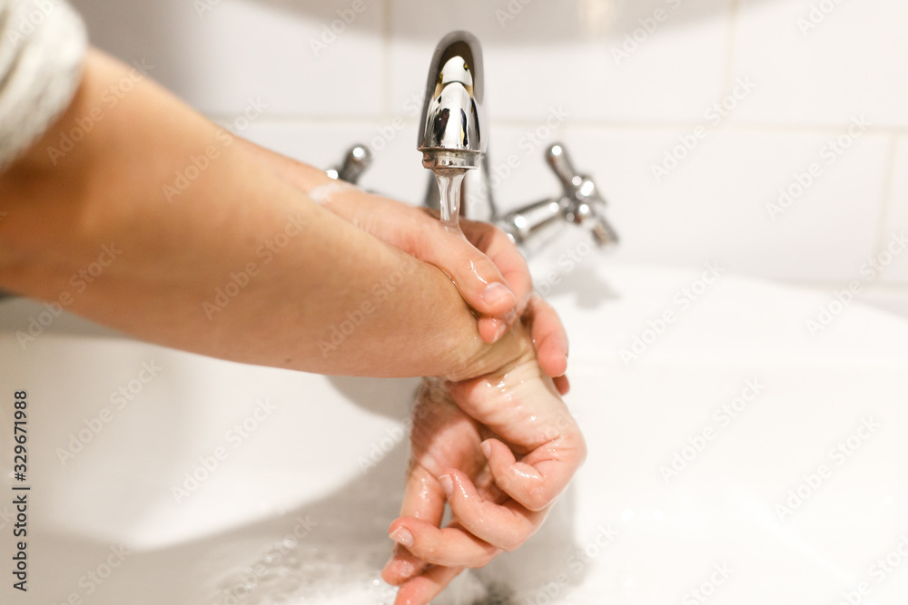 Washing hands. Hands washing under flowing water with proper technique ...