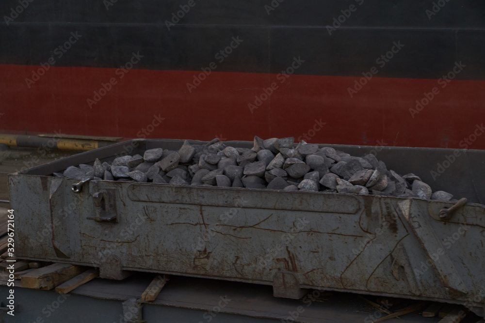 Loading cast iron ingots on ship bulk. Loading metal on ship ...