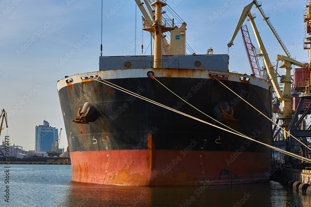 Loading cast iron ingots on ship bulk. Loading metal on ship ...