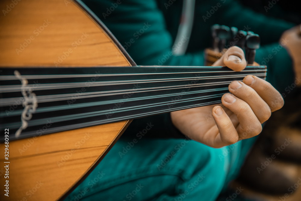 Arabic musician plays music on Oud traditional instrument Stock Photo ...