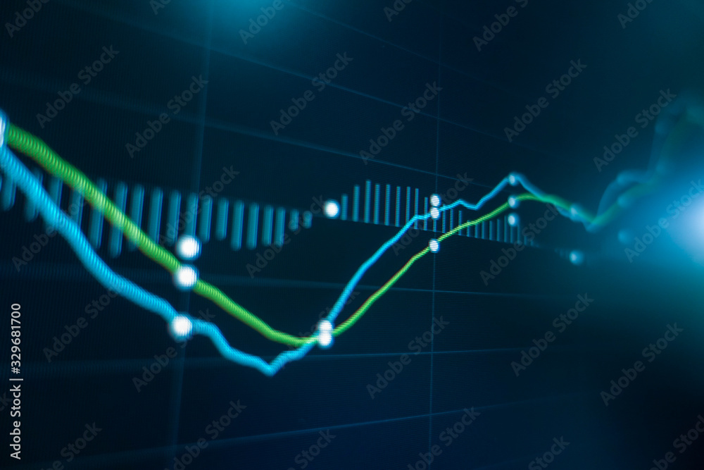Stock market trading graph and candlestick chart on screen monitor for ...