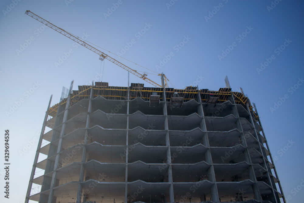 Construction of an integral concrete building. High-rise house, arrow ...