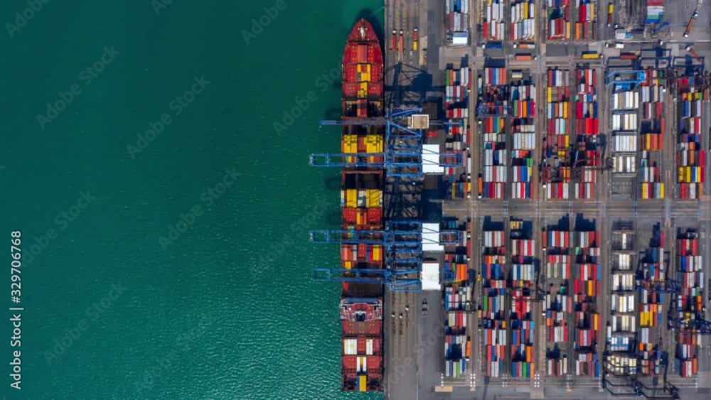 4K, Aerial view container cargo ship freight shipping unloading at ...