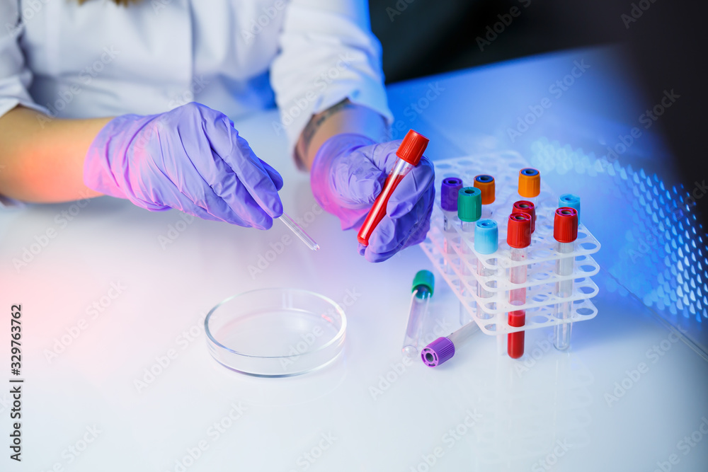 A medical professional, laboratory assistant, doctor performs an ...