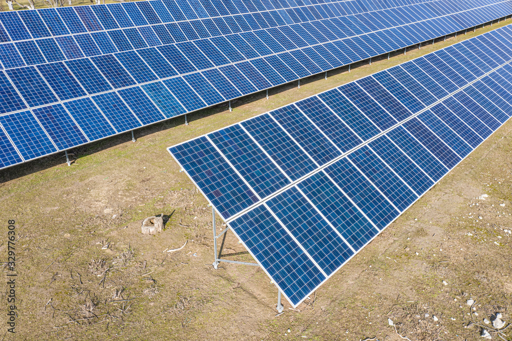 Blue panels of solar power plant in the backyard. Energy independence ...