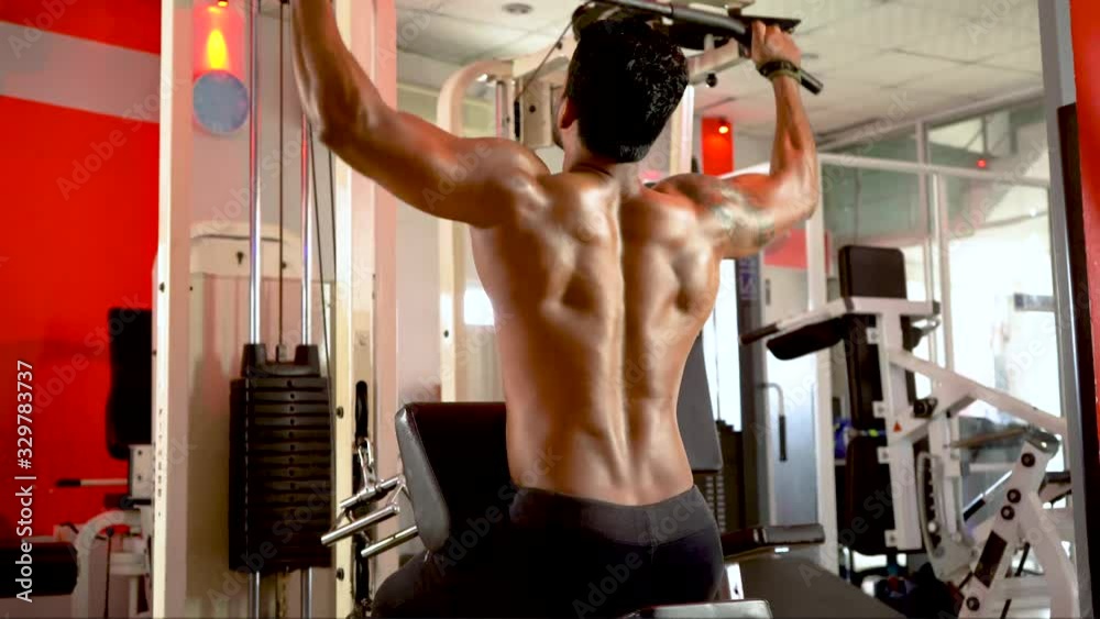 Man working out lat pulldown training at gym Upper body strength ...