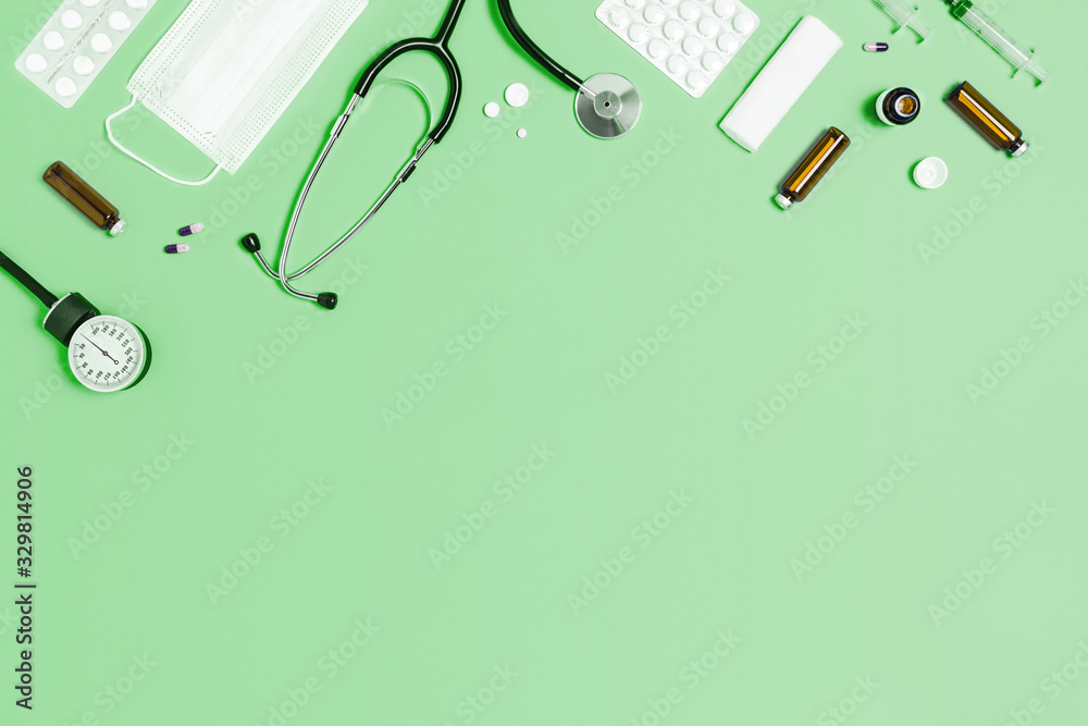 Medical mint green background with different accessories: stethoscope ...