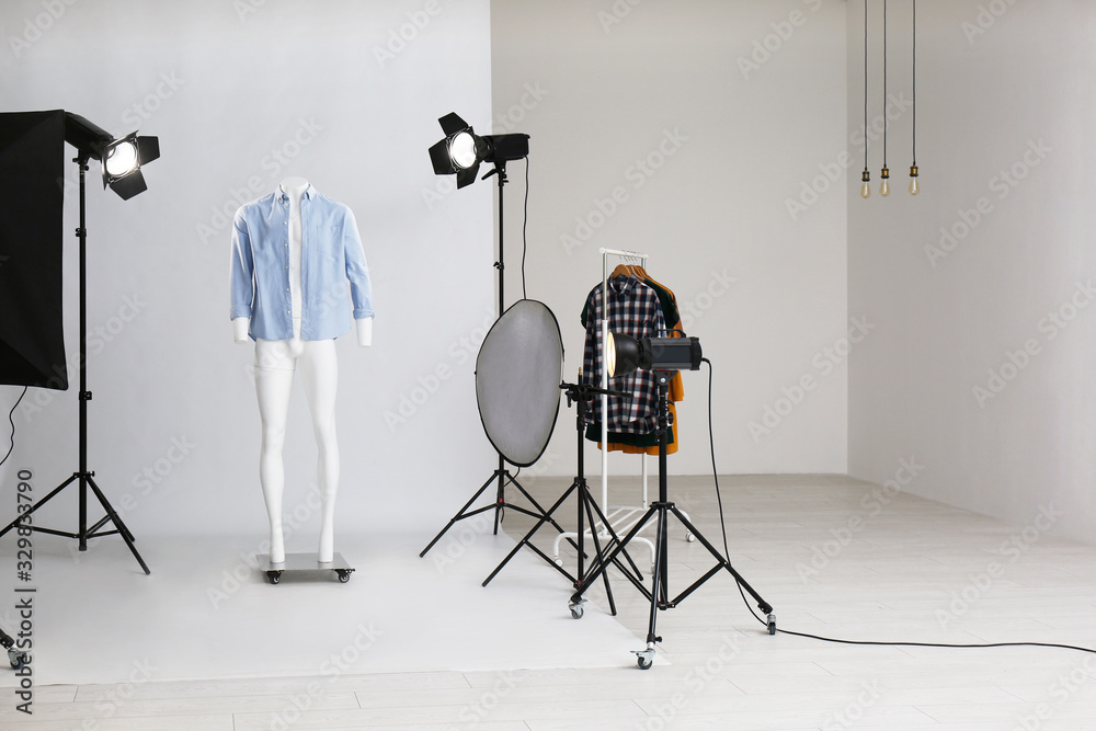 Ghost mannequin with modern clothes in professional photo studio Stock ...