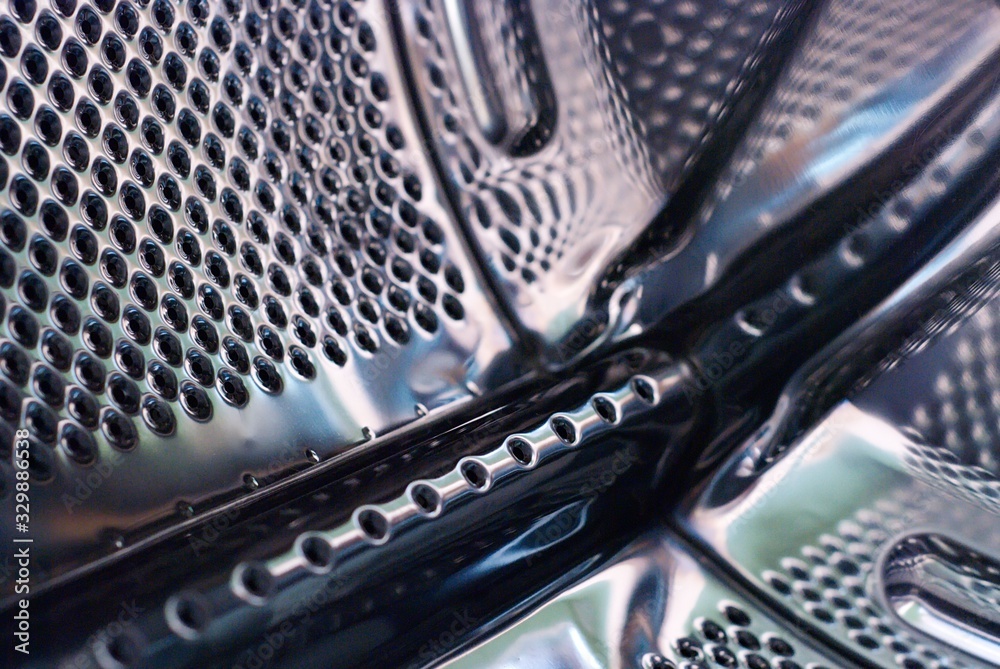 Washing machine tank or drum, background, texture. Perforated steel ...
