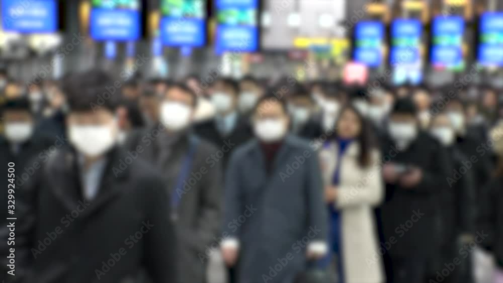 TOKYO, JAPAN - MARCH 2020 : Crowd of people walking at Shinagawa station in morning rush hour ...