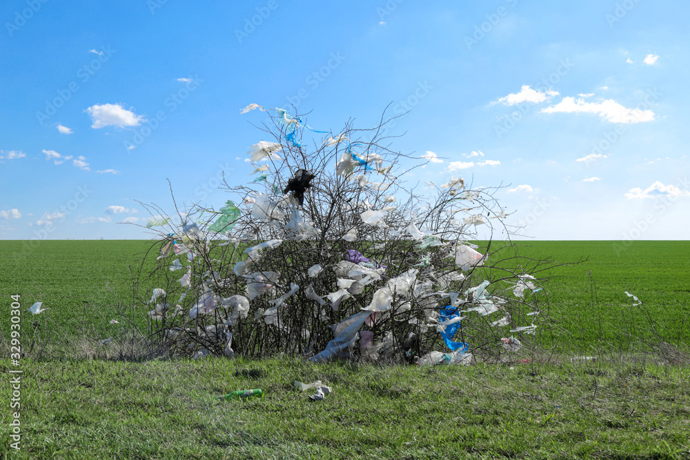 environmental pollution. trash in the trees. bad attitude to nature ...