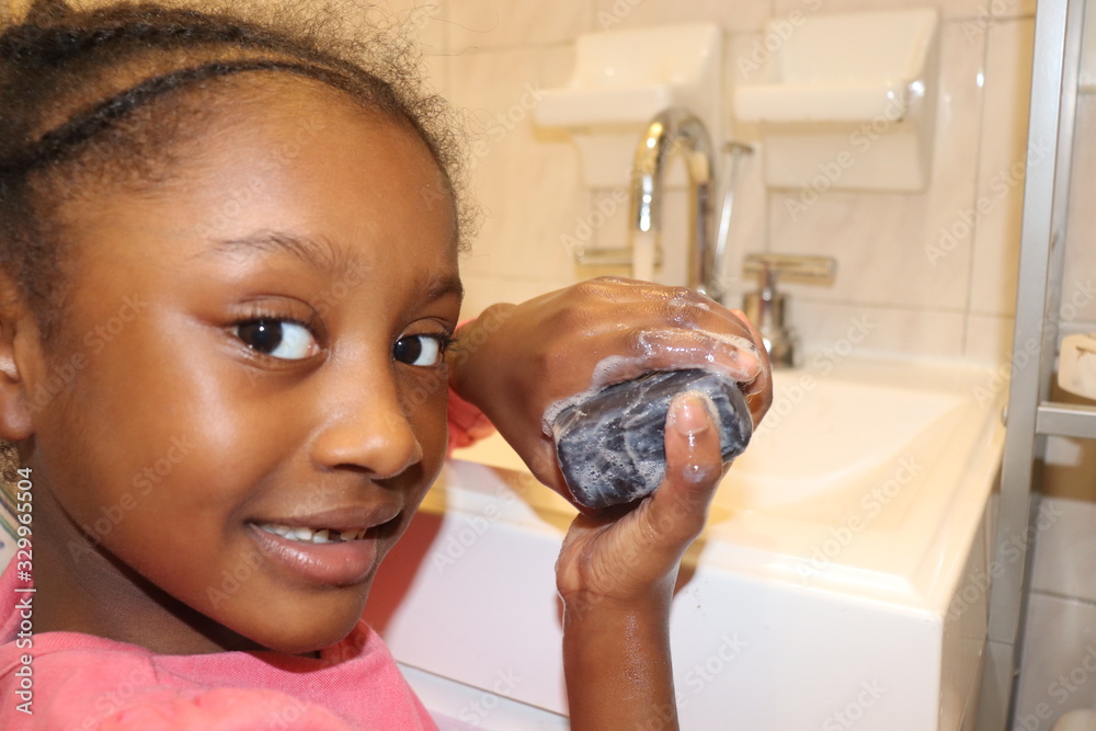 Kid washing hands with soap Stock Photo | Adobe Stock