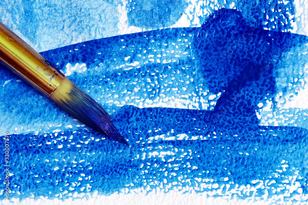 watercolor paper and blue watercolor paint. wet watercolor paper and ...