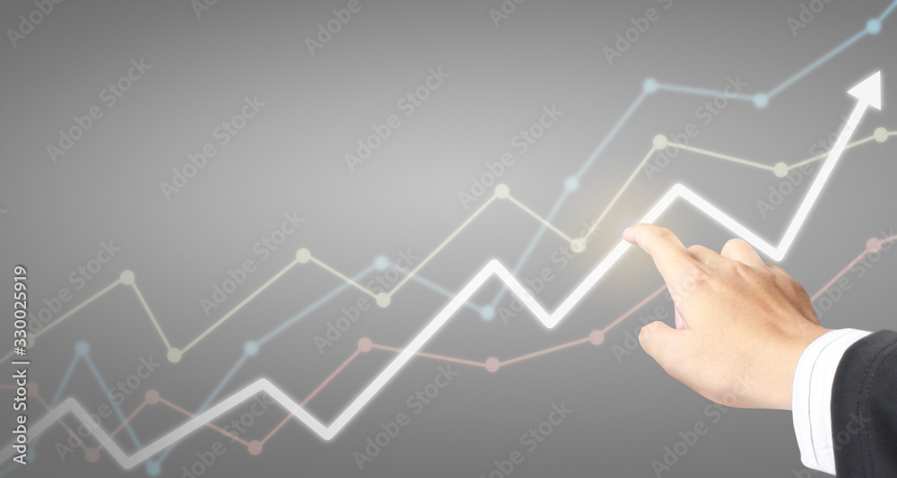 Hand touching graphs of financial indicator and accounting market ...