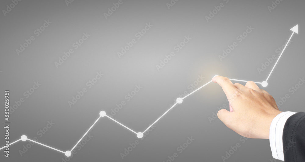 Hand touching graphs of financial indicator and accounting market ...